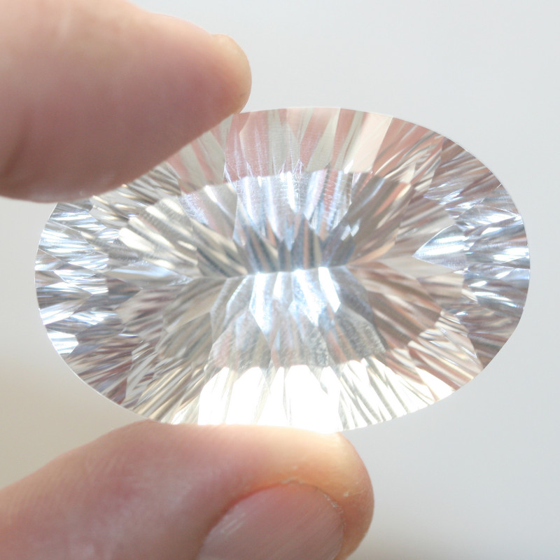 89.8 Ct Big Rock Crystal Quartz Faceted Oval 37x24.5mm.-(SKU 410)